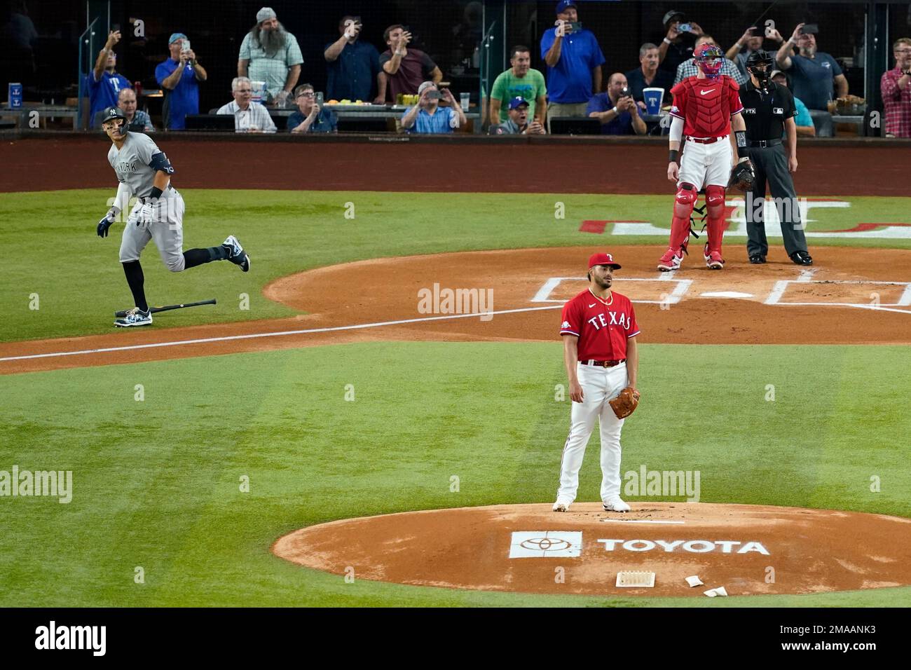 New York Yankees' Aaron Judge watches his a solo home run, his 62nd of ...