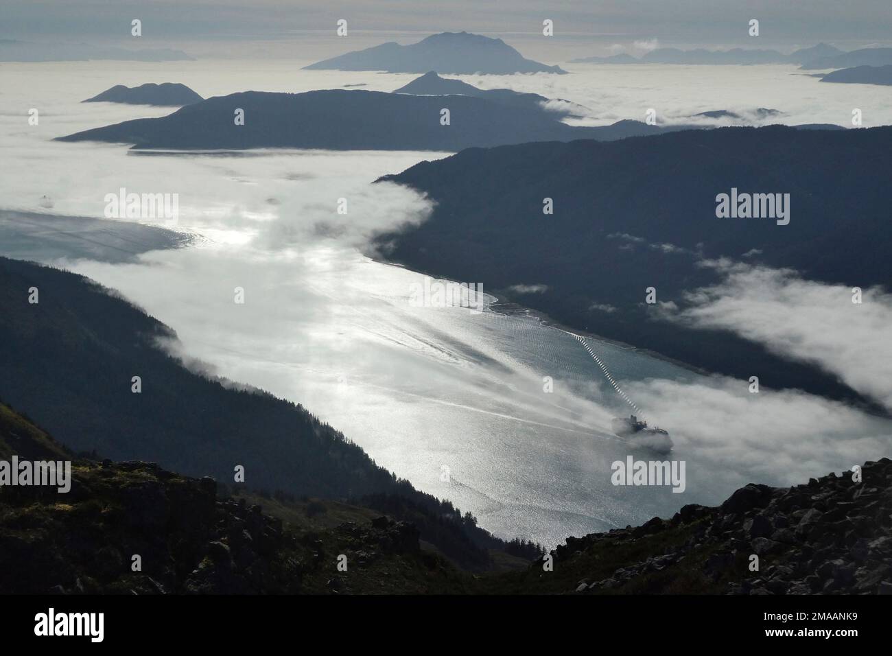 A cruise ship makes its way in Gastineau Channel toward downtown Juneau ...