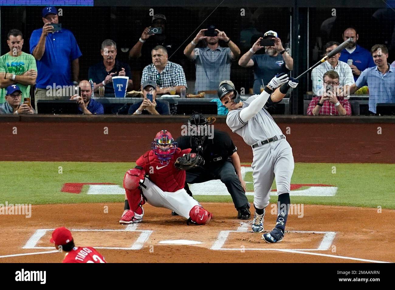 New York Yankees' Aaron Judge connects for a solo home run, his 62nd of ...