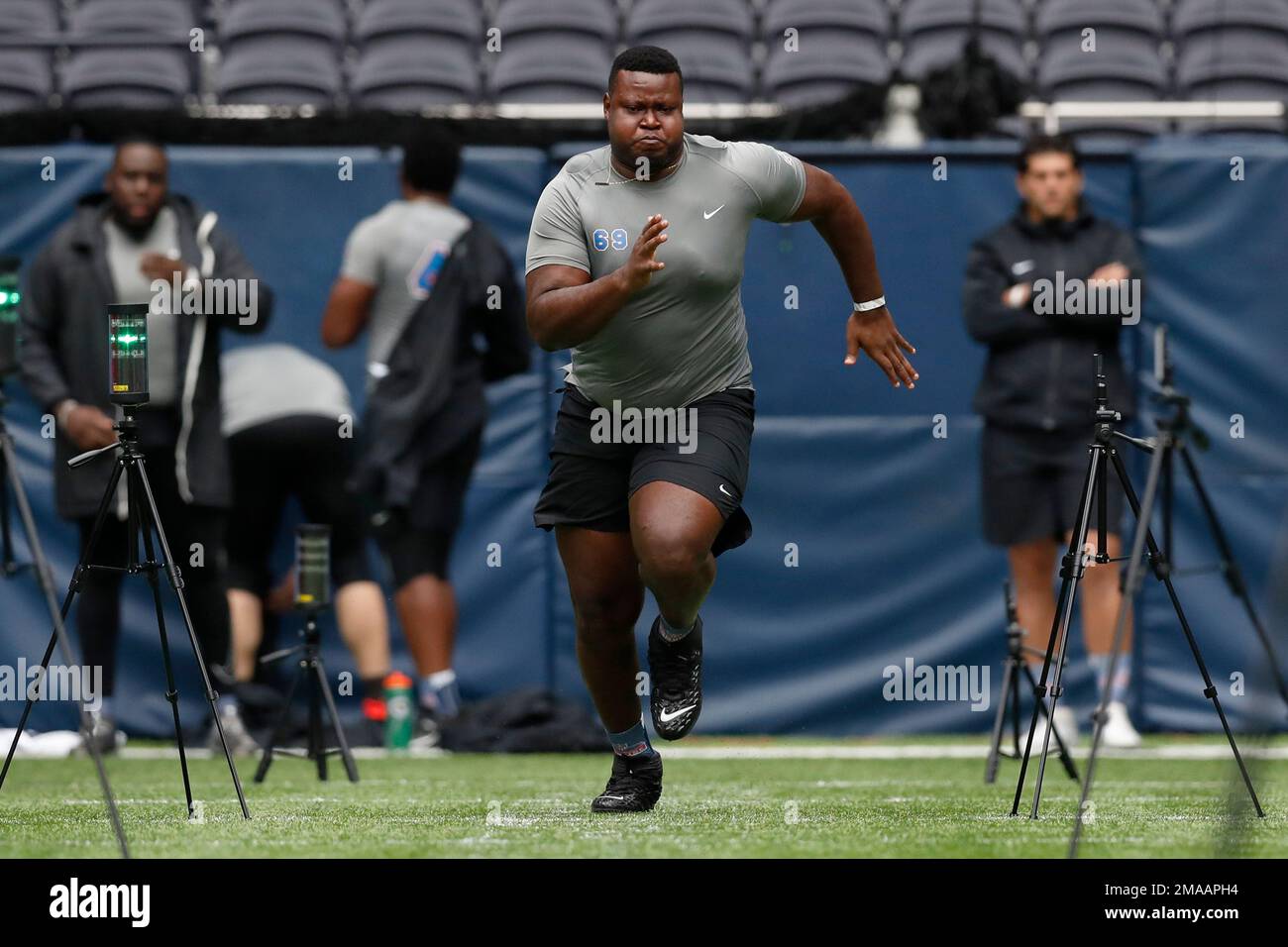Offensive lineman Chibuike Chisom Omemgboji, of Nigeria, runs the 40 ...