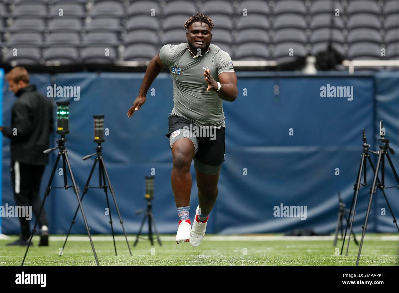 Offensive lineman Basil Chijioke Okoye, of Nigeria, runs the 40-yard ...