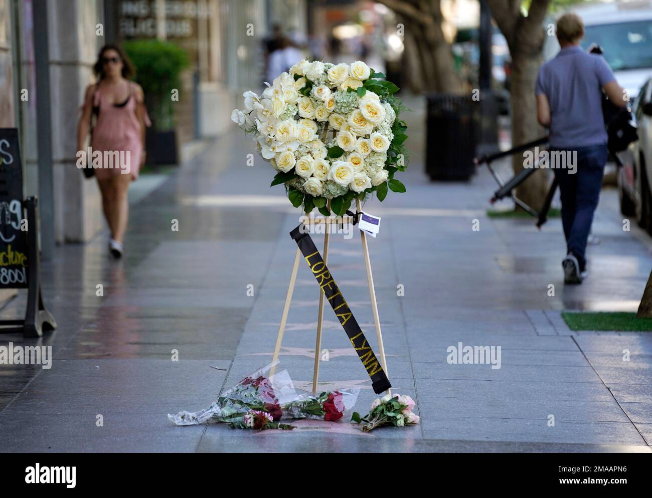 A wreath and flowers lie atop the late country singer Loretta Lynn's ...