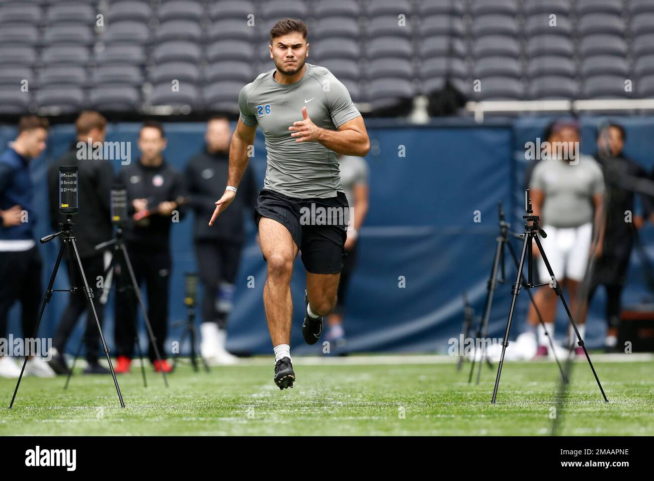 Linebacker Flamur Simon, of Germany, runs the 40-yard dash at the NFL ...