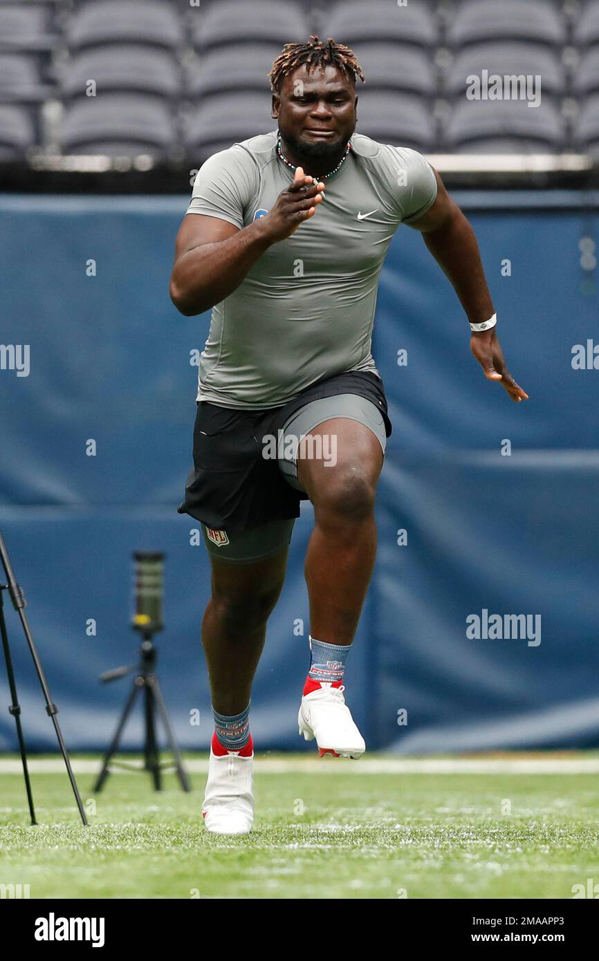 Offensive lineman Basil Chijioke Okoye, of Nigeria, runs the 40-yard ...