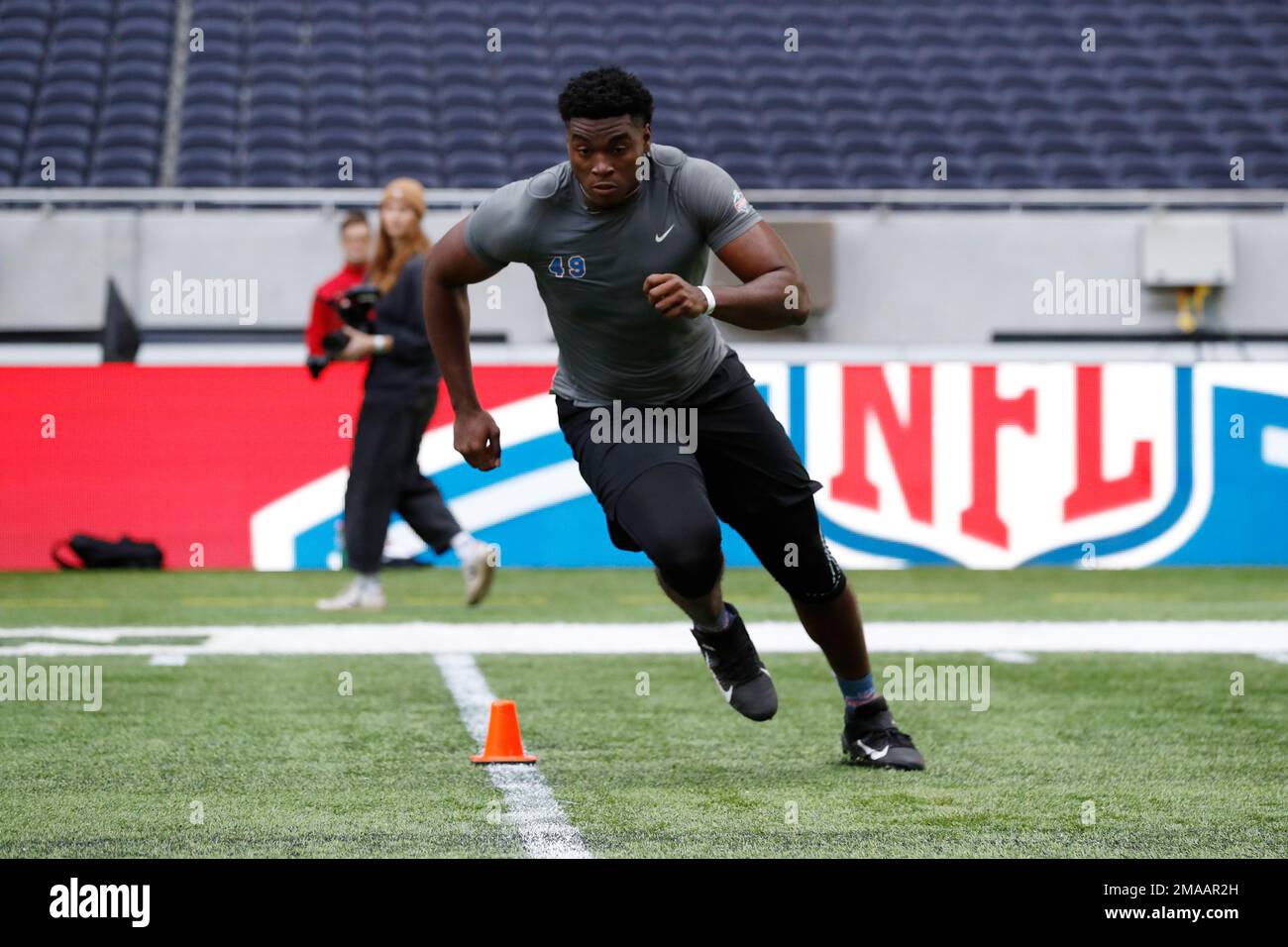 Offensive lineman Jason Godrick, of Nigeria, participates in a drill at ...