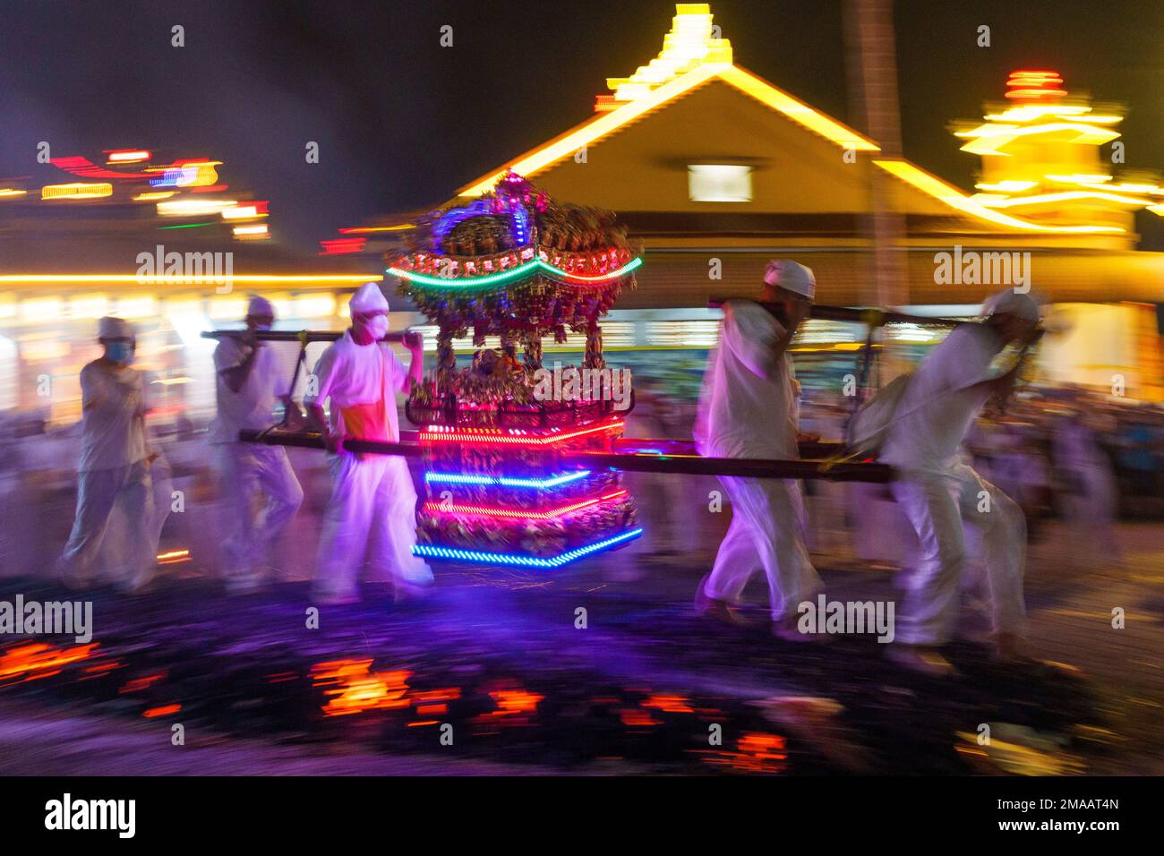 Malaysian Chinese, carrying an Emperor God, walk barefoot over burning ...