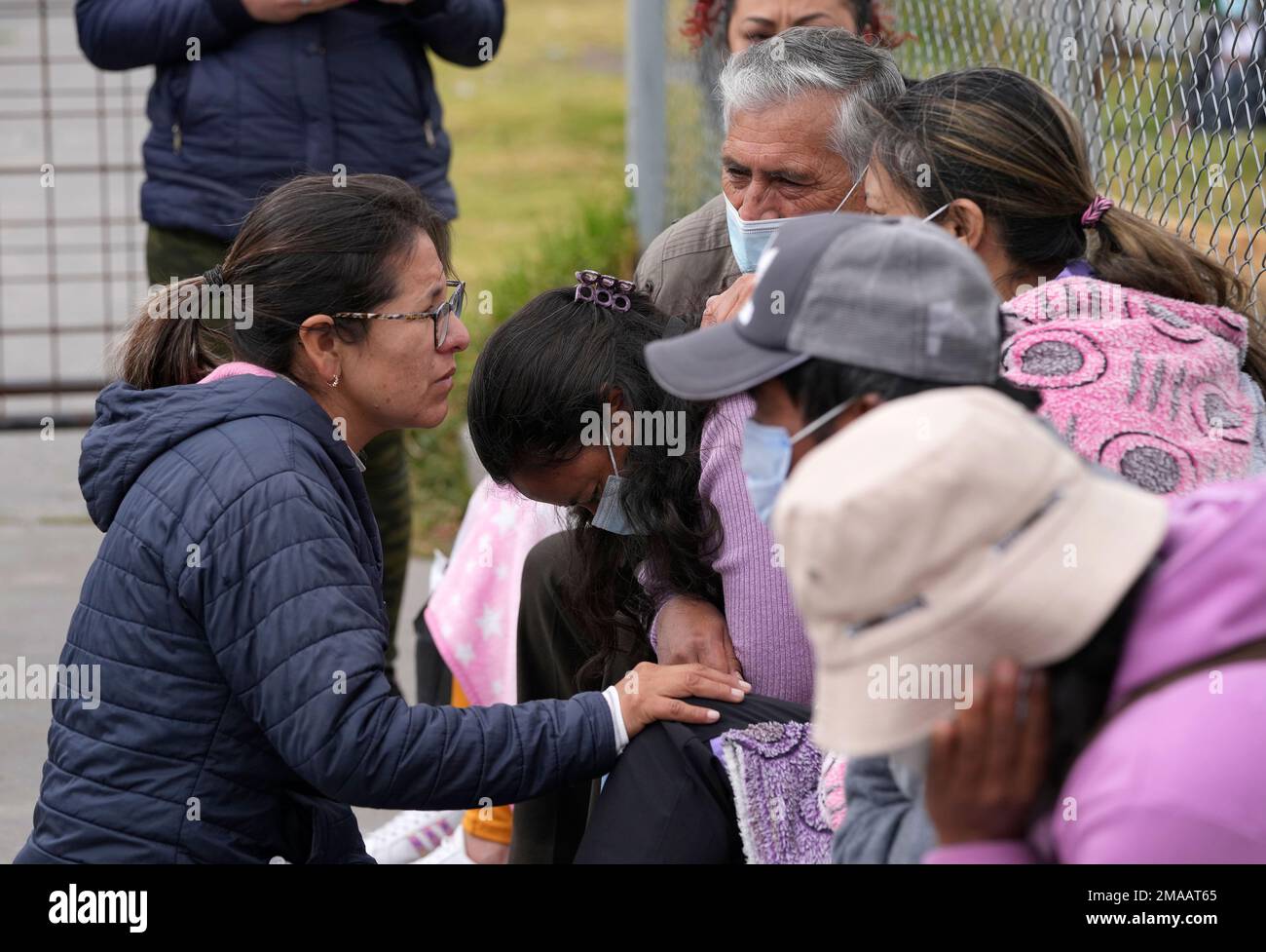 Family and friends of inmates console each other as they wait for news ...