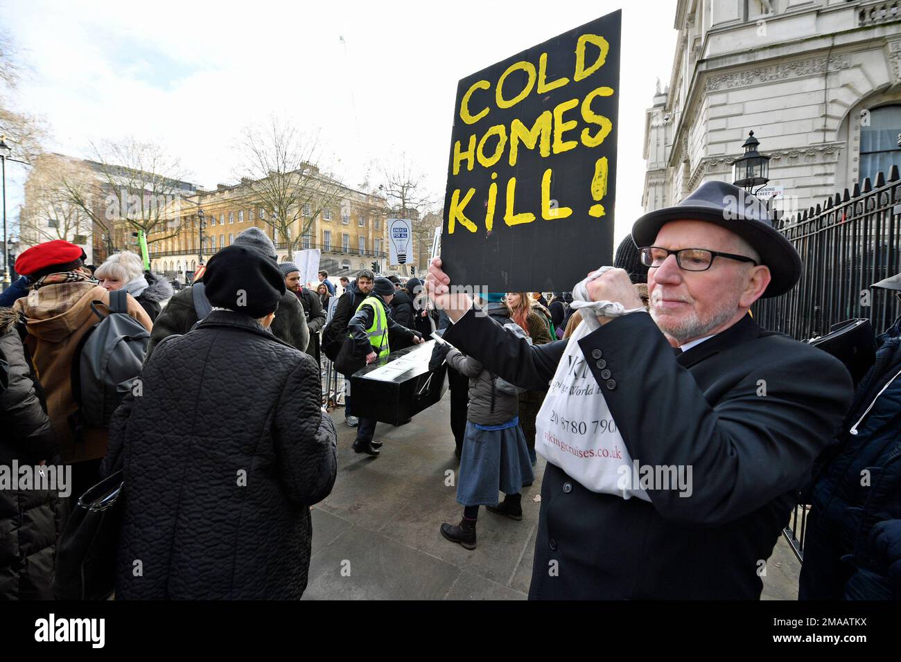 Protesters campaigning against people dying of cold, as they deliver a ...