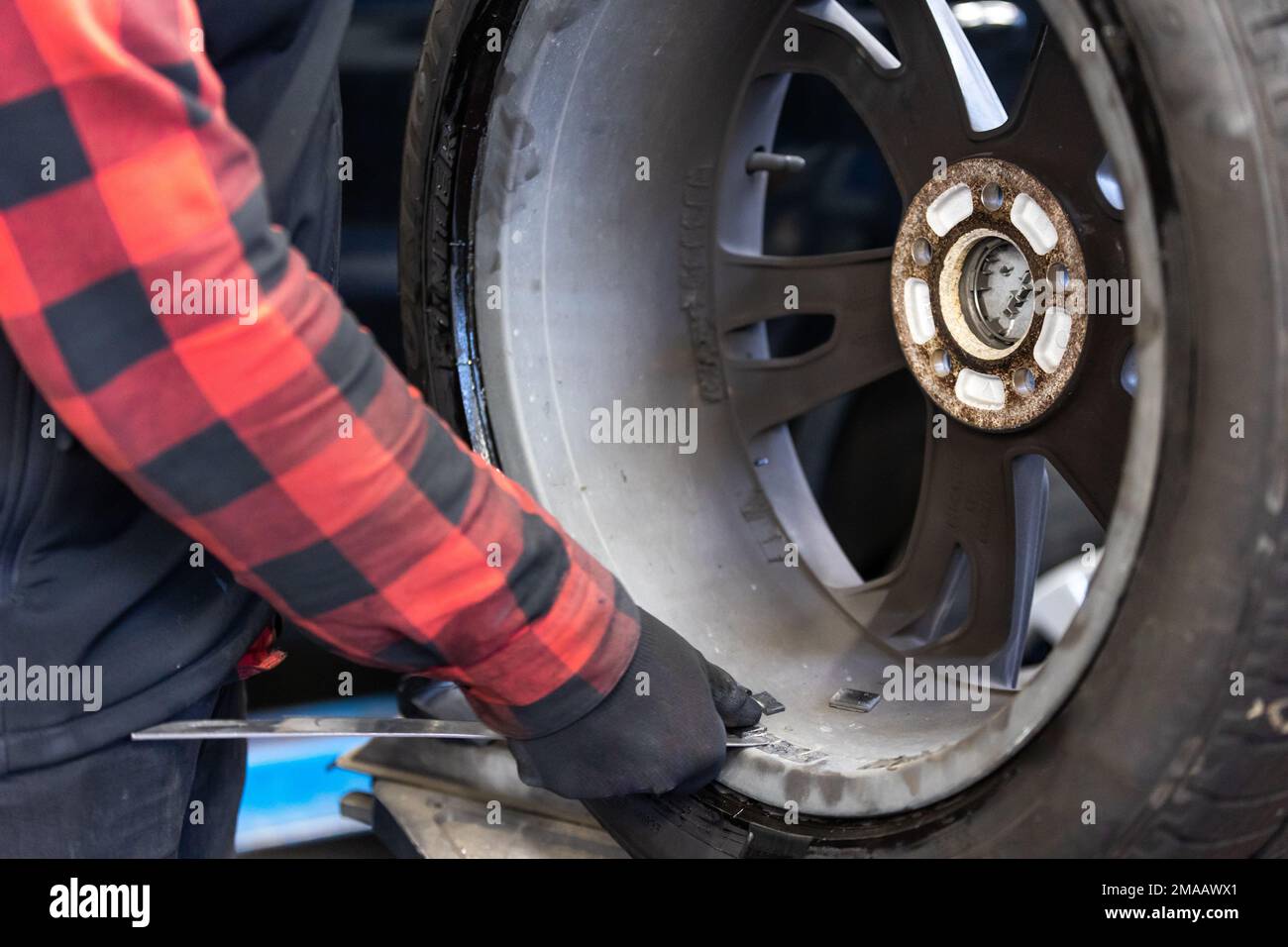 Process of wheel balancing at car service, transport concept Stock ...