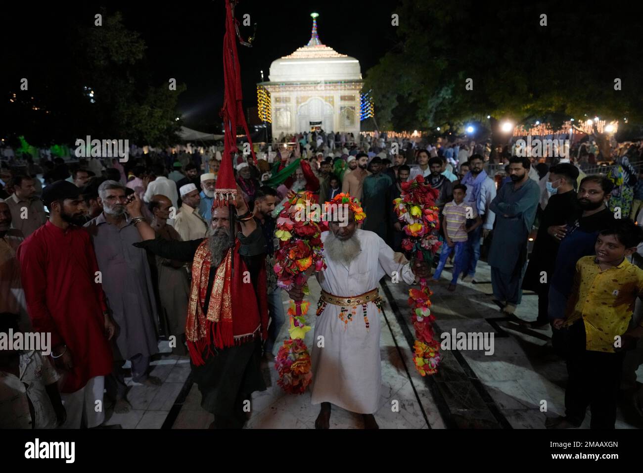 Devotees attend an annual festival at the shrine of the famous 15th ...