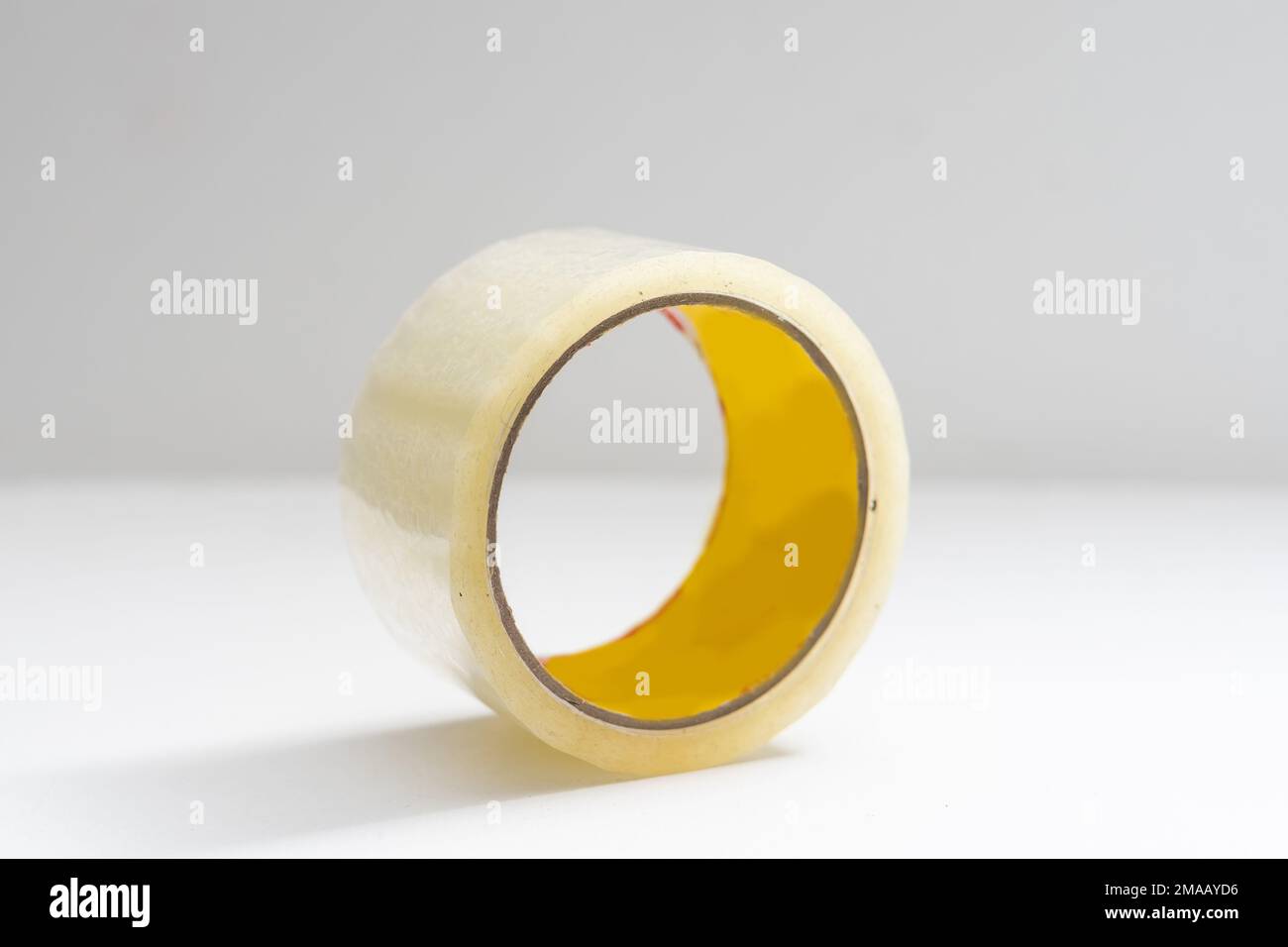 Roll of adhesive tape isolated on white Stock Photo - Alamy