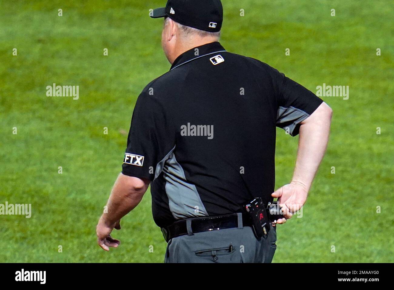 Umpire Marvin Hudson, left, makes the call after a review with umpire ...