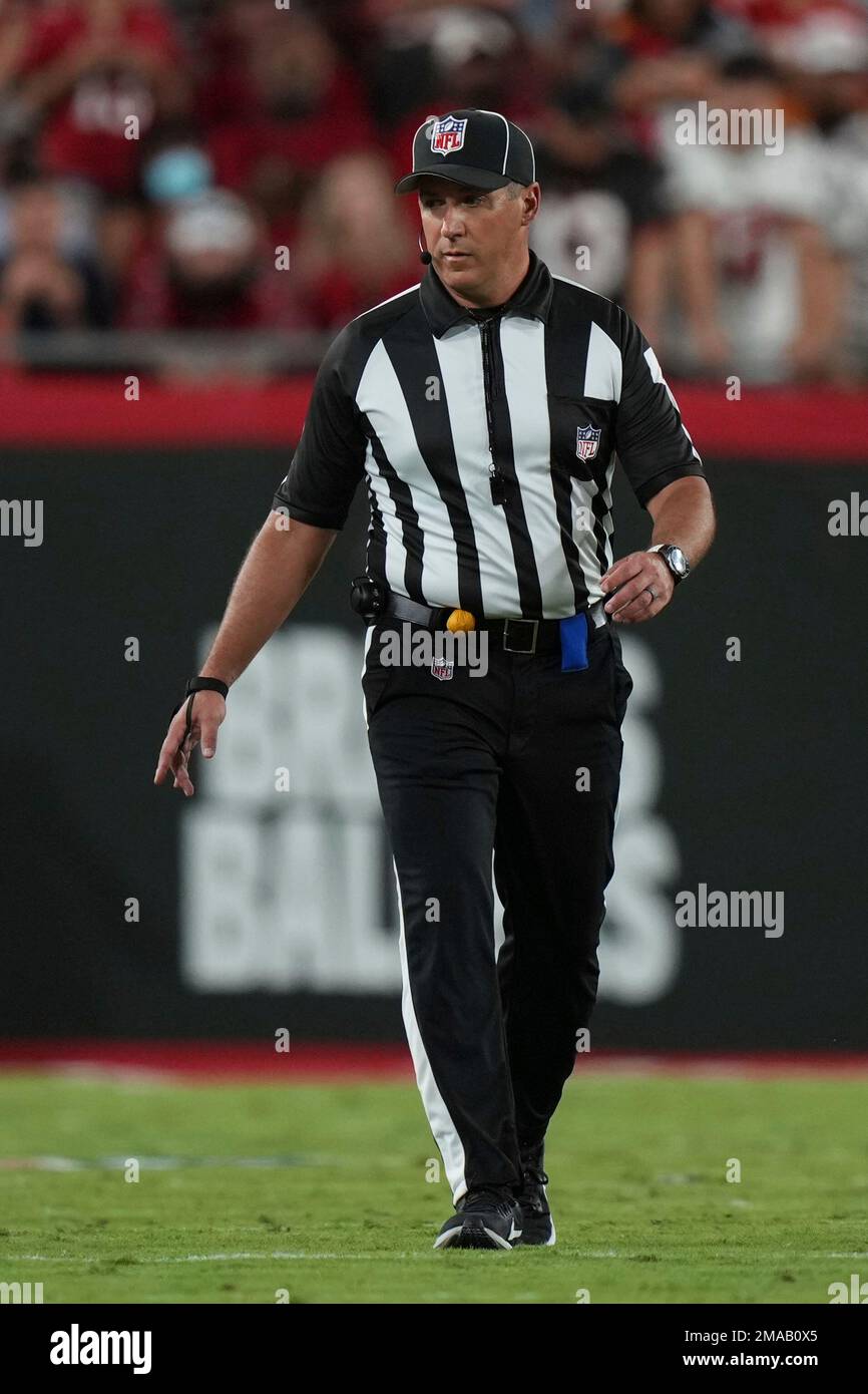 Feld judge Joe Blubaugh (57) listens to the Tampa Bay Buccaneers team ...