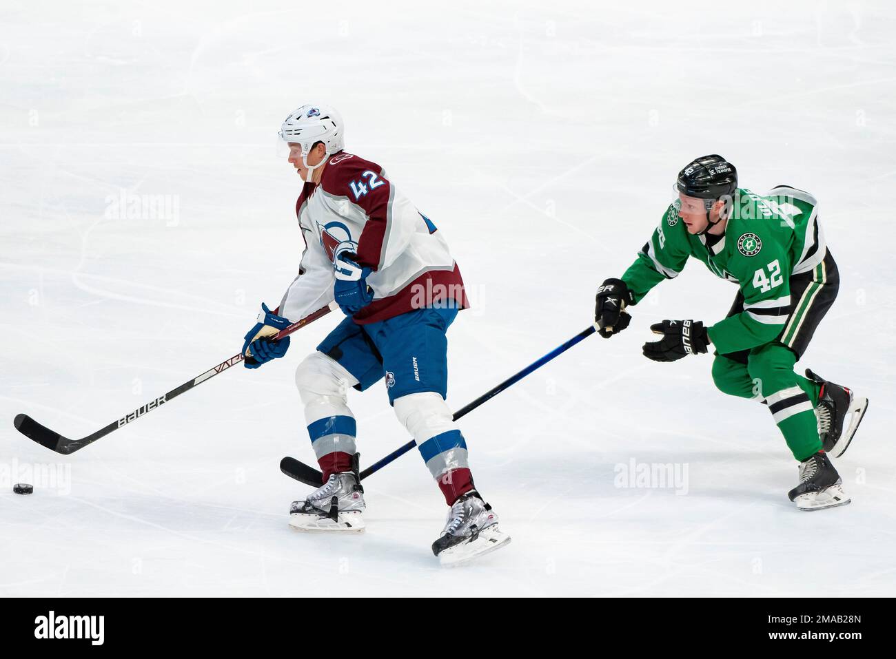 From left, Colorado Avalanche defenseman Josh Manson (42) skates past ...