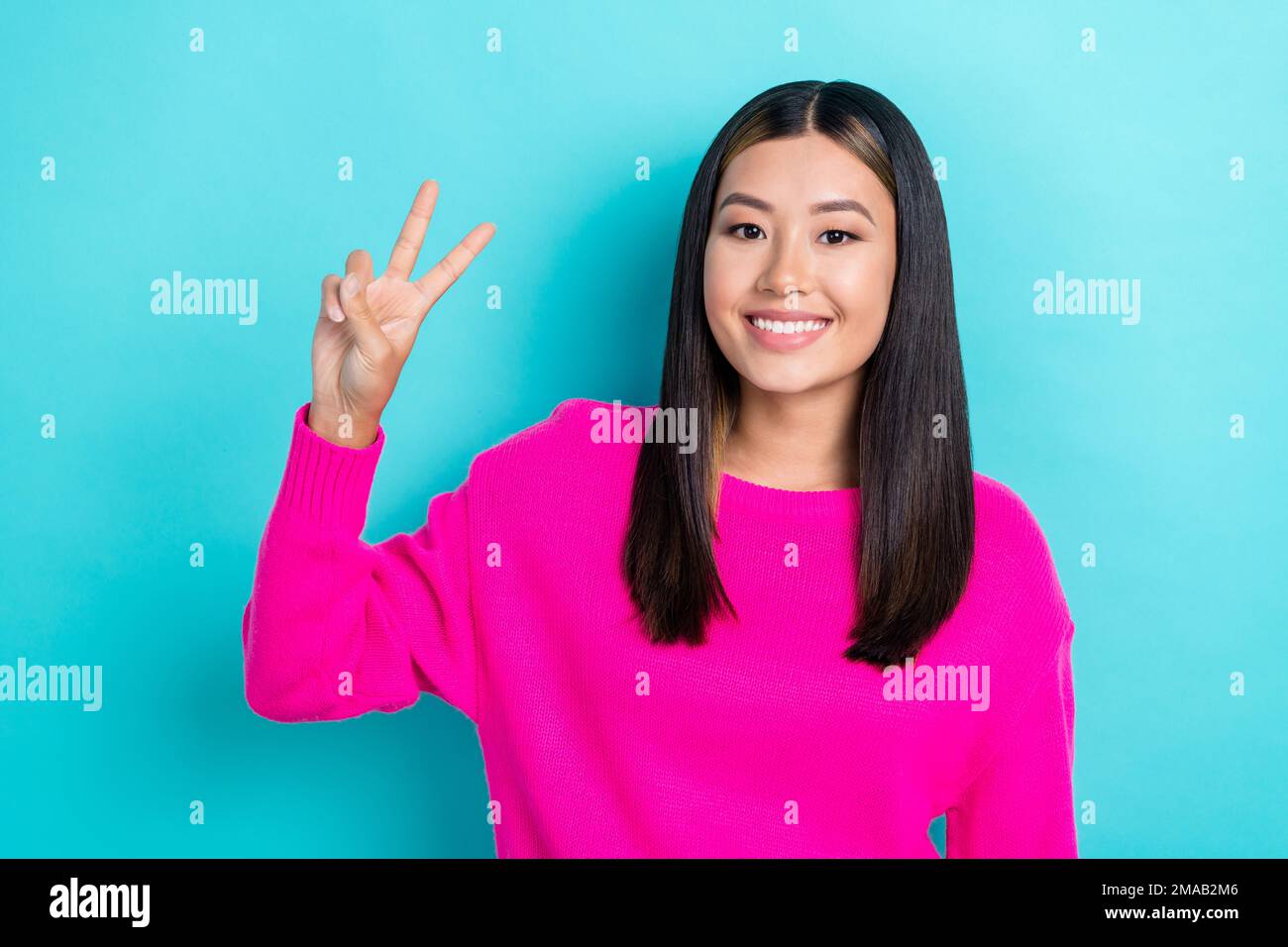 Photo of young friendly chinese gorgeous lady wear pink knitted jumper ...