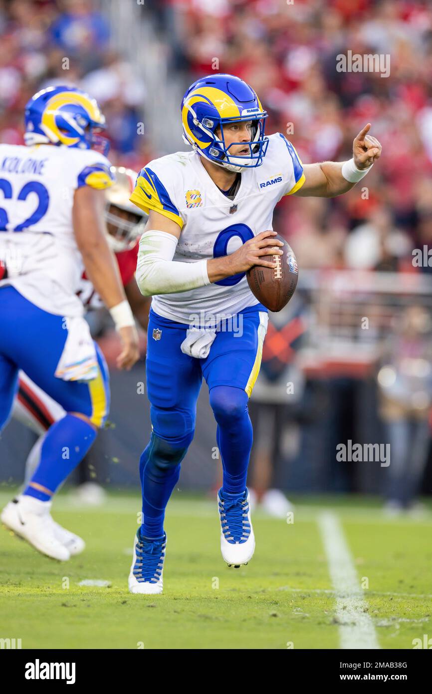Quarterback (9) Matthew Stafford of the Los Angeles Rams rolls out to ...