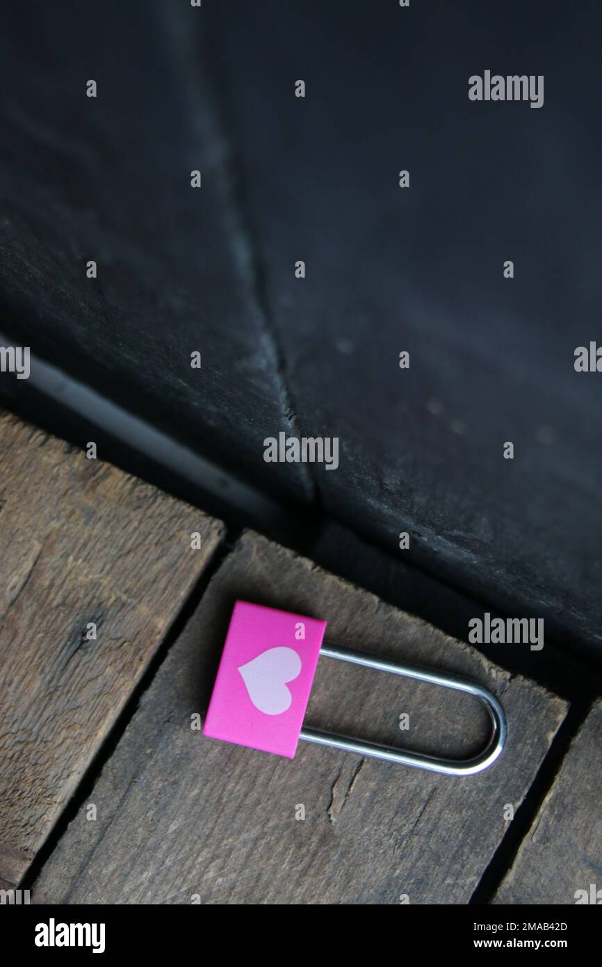 Pink padlock with a heart. Creative Romantic background Stock Photo - Alamy