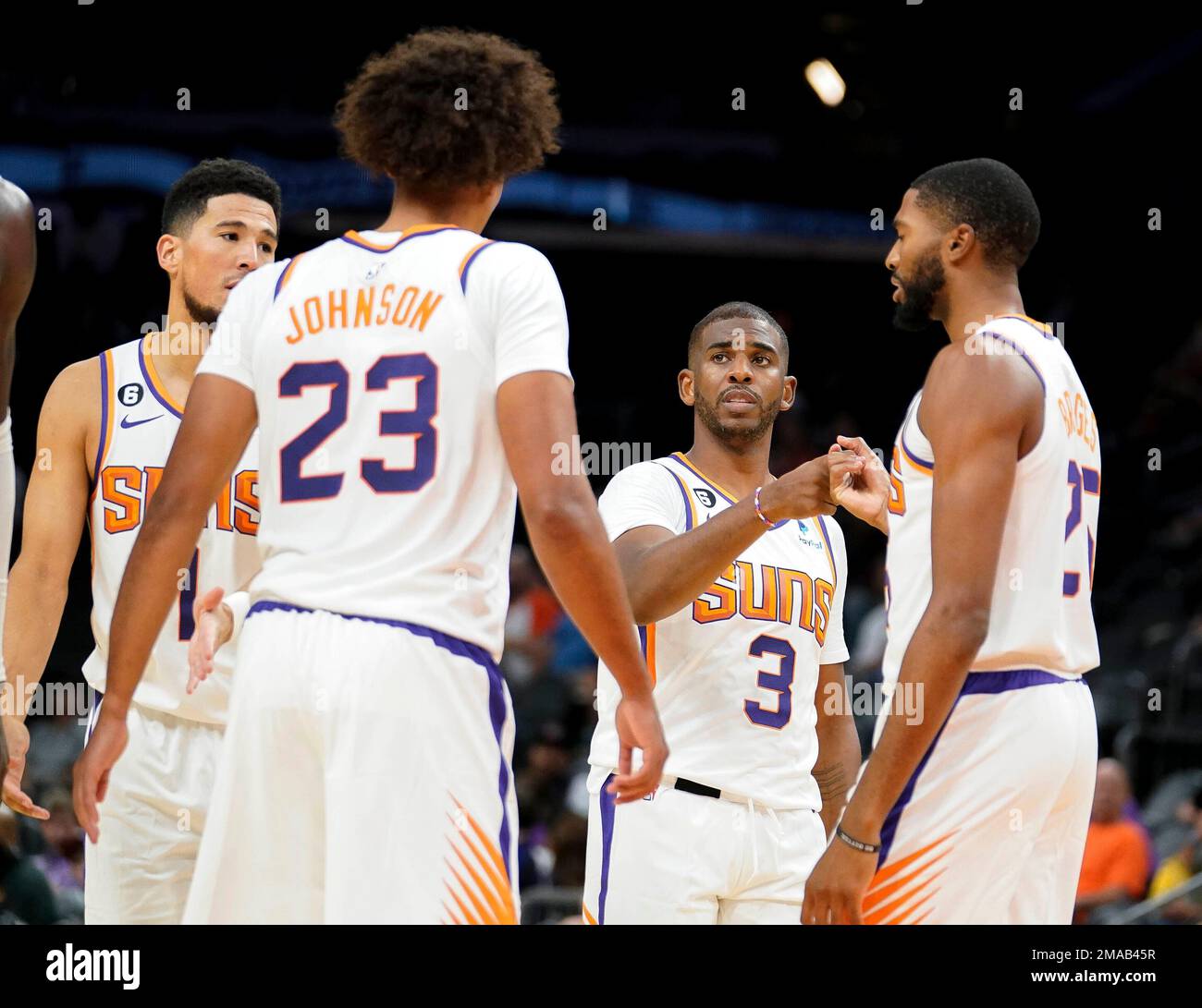 Phoenix Suns' Chris Paul (3) bumps fists with teammates Mikal Bridges ...