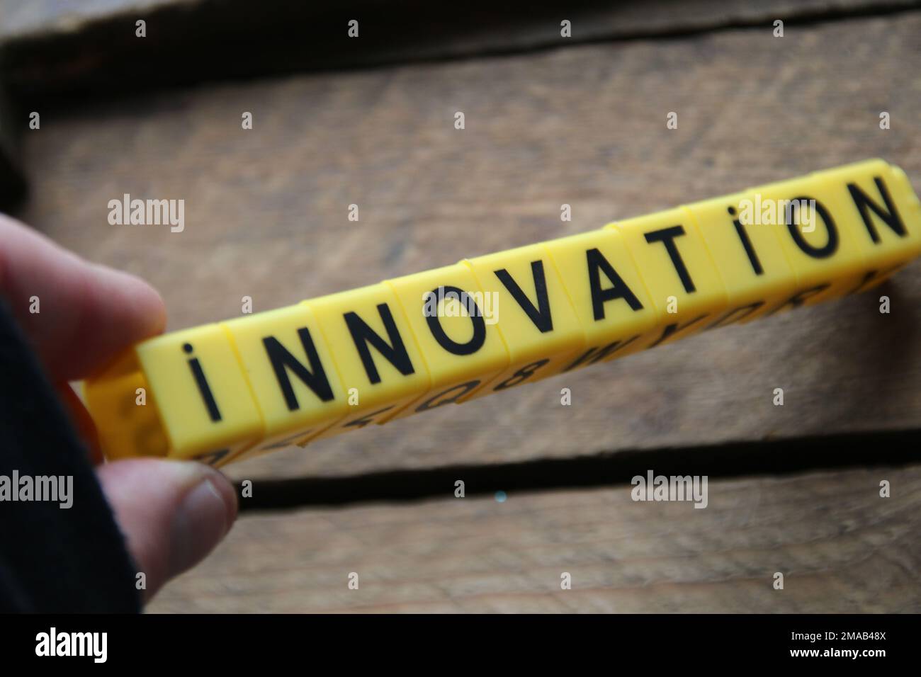 Innovation creative concept. Lettering from yellow cubes Stock Photo ...