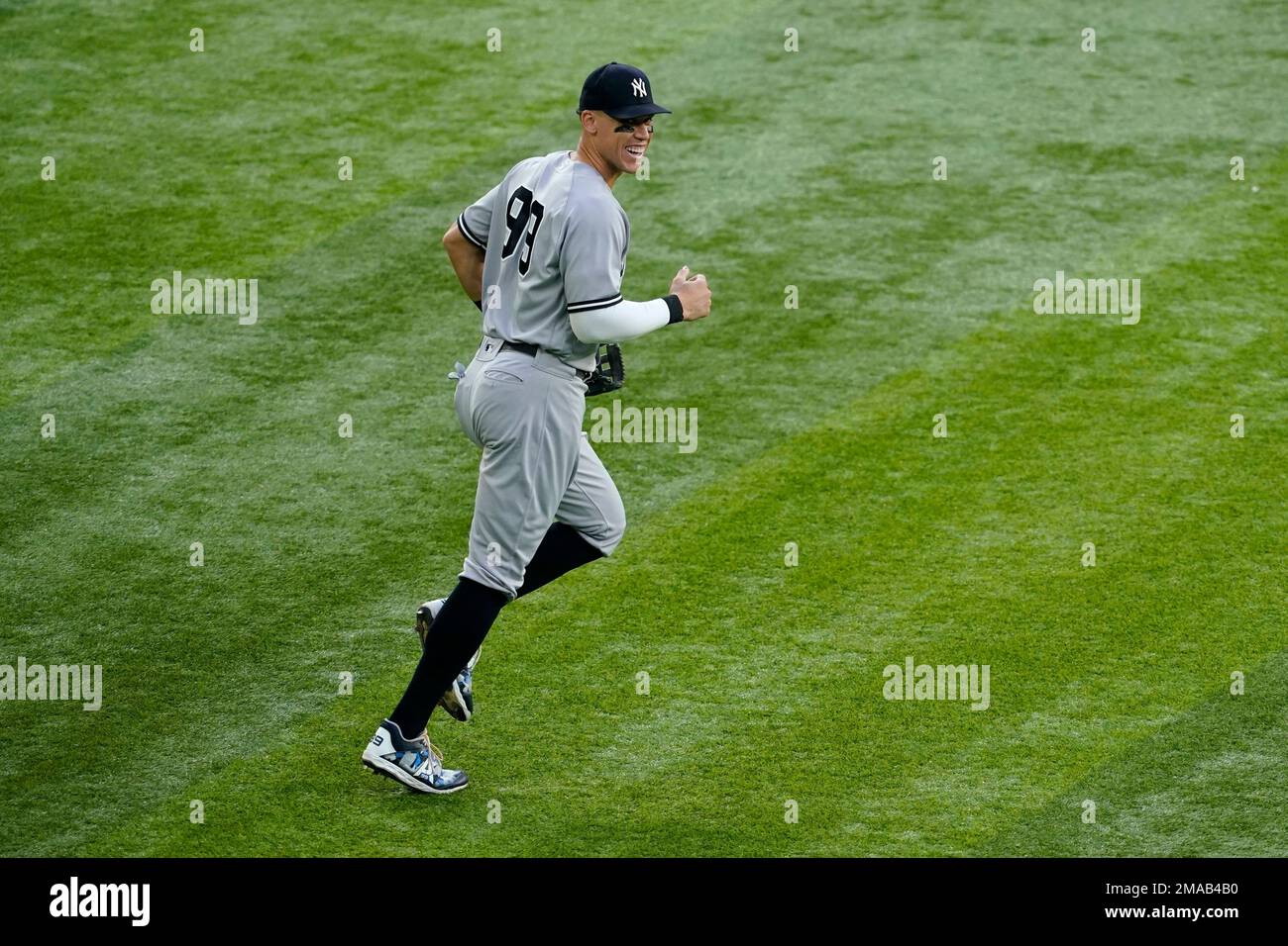 New York Yankees' Aaron Judge smiles at a teammate after catching a ...