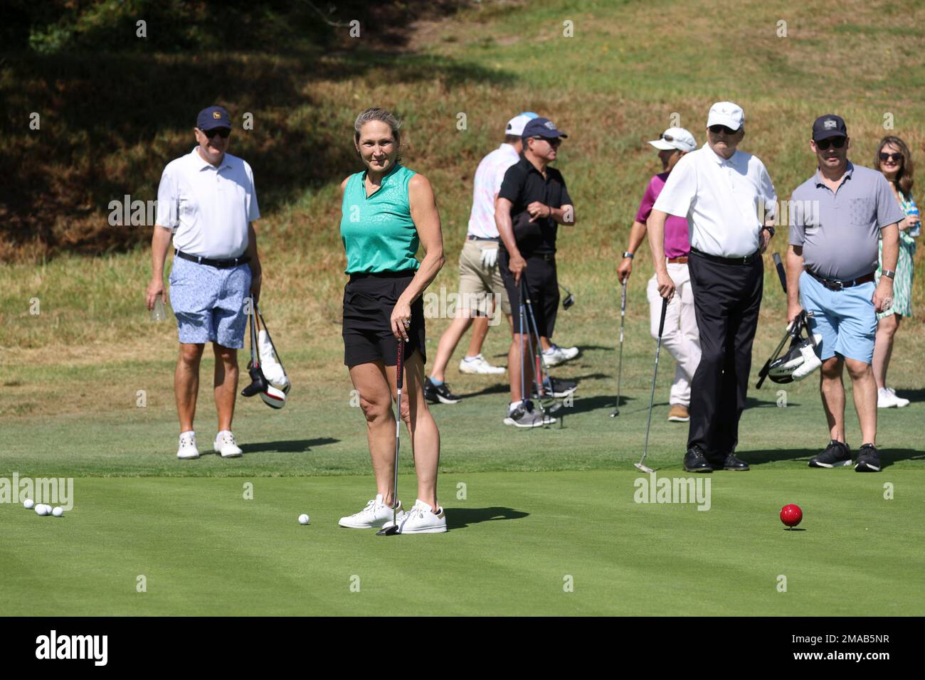 Deborah Bradley participates in the putting competition hosted by Andia ...