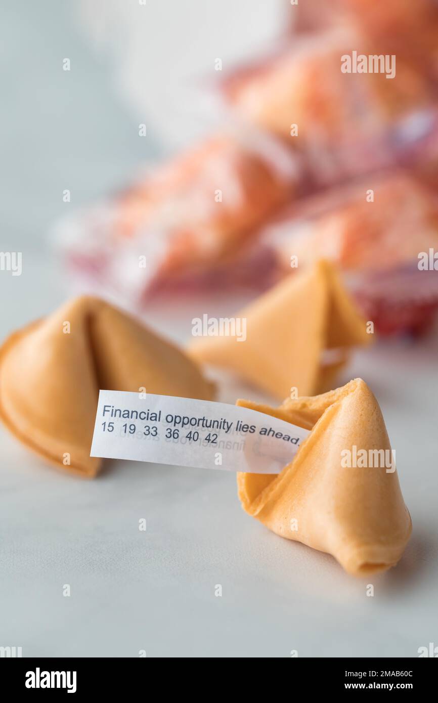 Fortune cookies with a fortune note in the one in front Stock Photo - Alamy