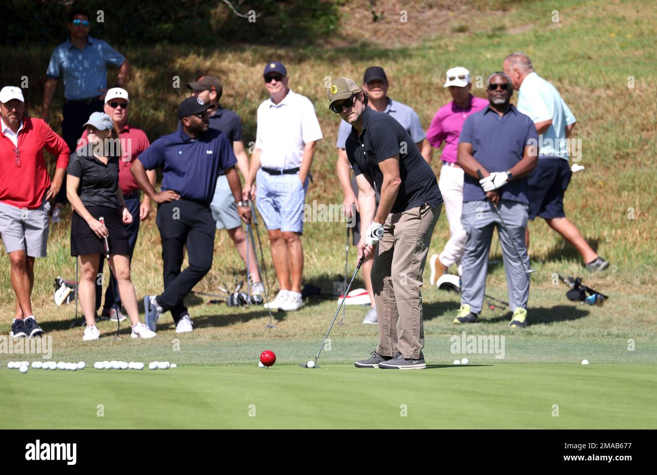 Matt Letscher participates in the putting competition hosted by Andia ...