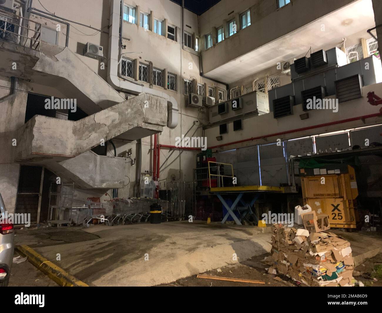 The back view of a building at night Stock Photo - Alamy