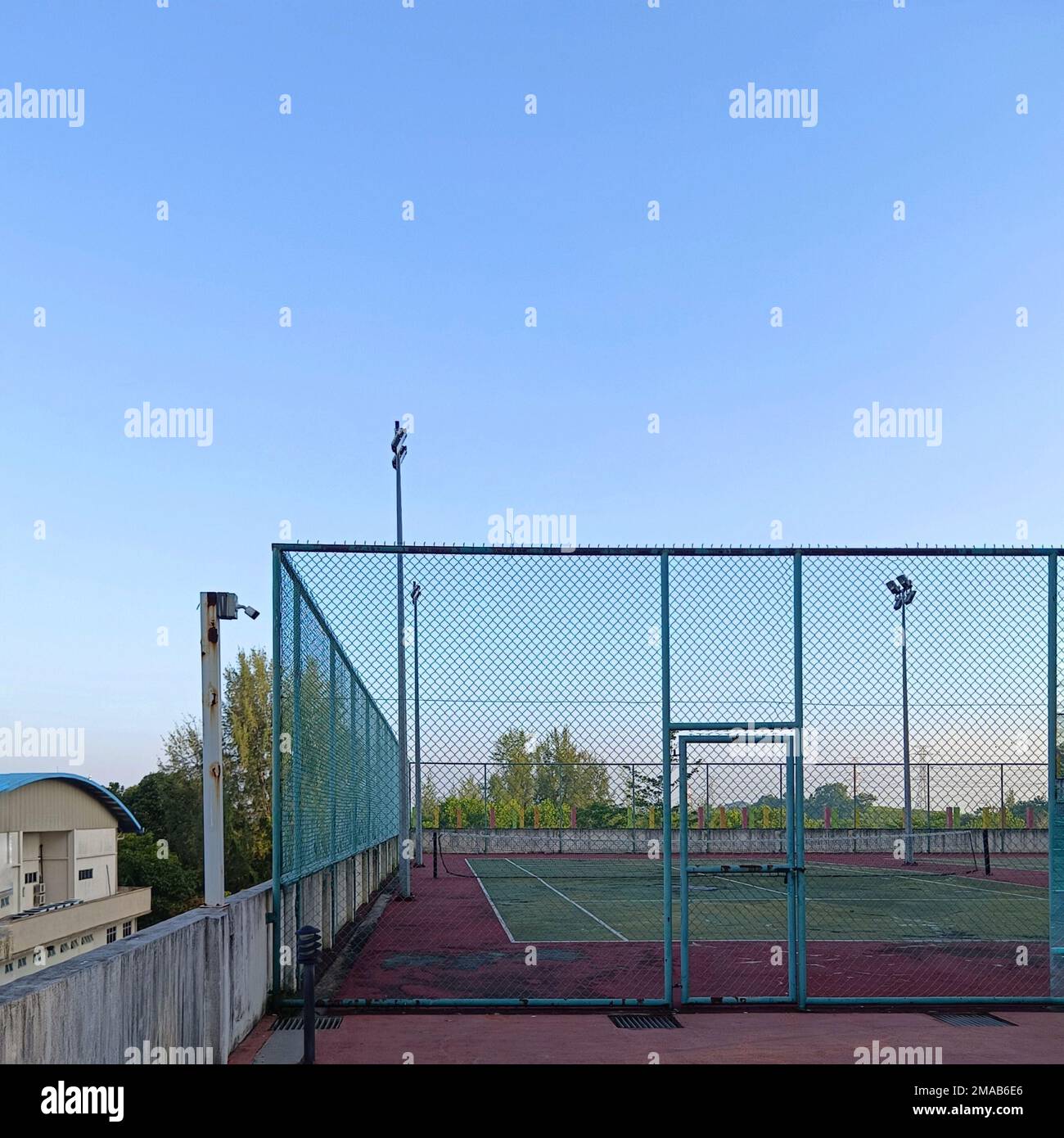 The metal fence of a playground field against the background of the ...
