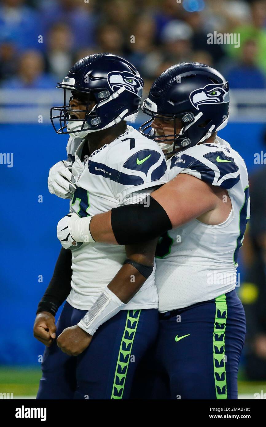 Seattle Seahawks quarterback Geno Smith is hugged by guard Austin ...