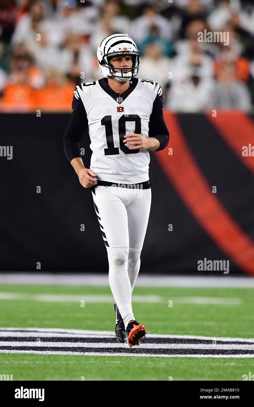 Cincinnati Bengals punter Kevin Huber (10) runs after punting the ball ...