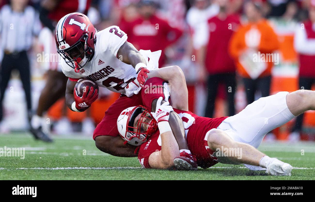 Nebraska's Isaac Gifford, below, tackles Indiana running back Shaun ...