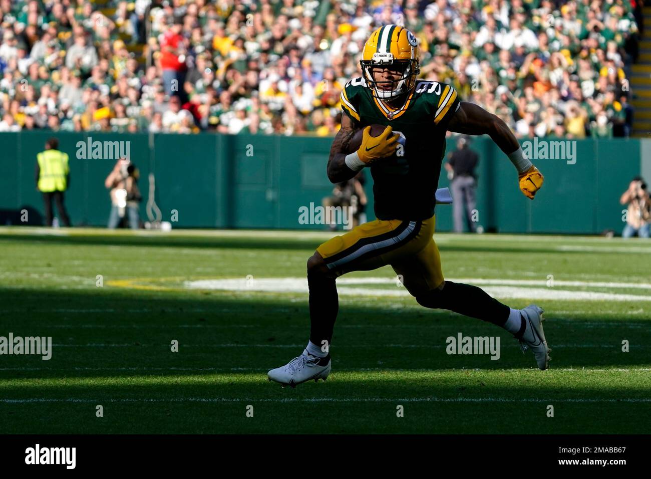 Green Bay Packers' Christian Watson runs during the first half of an ...