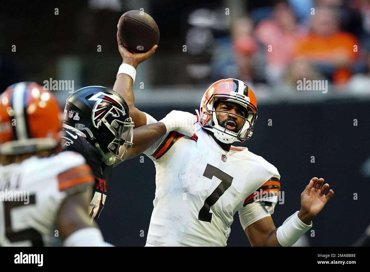 Cleveland Browns quarterback Jacoby Brissett (7) is hit by Atlanta ...
