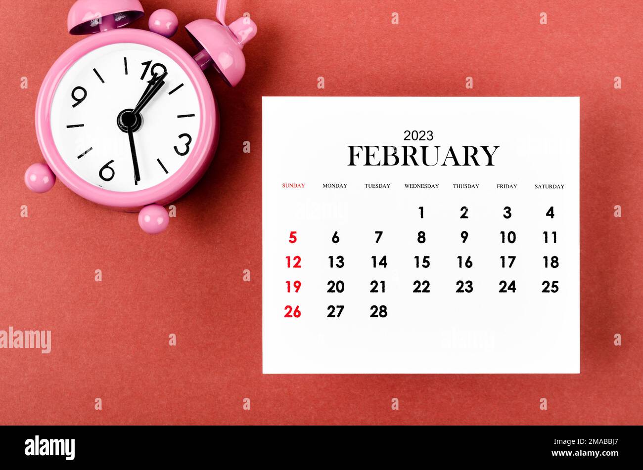 February 2023 Monthly calendar year for 2023 year with alarm clock on ...