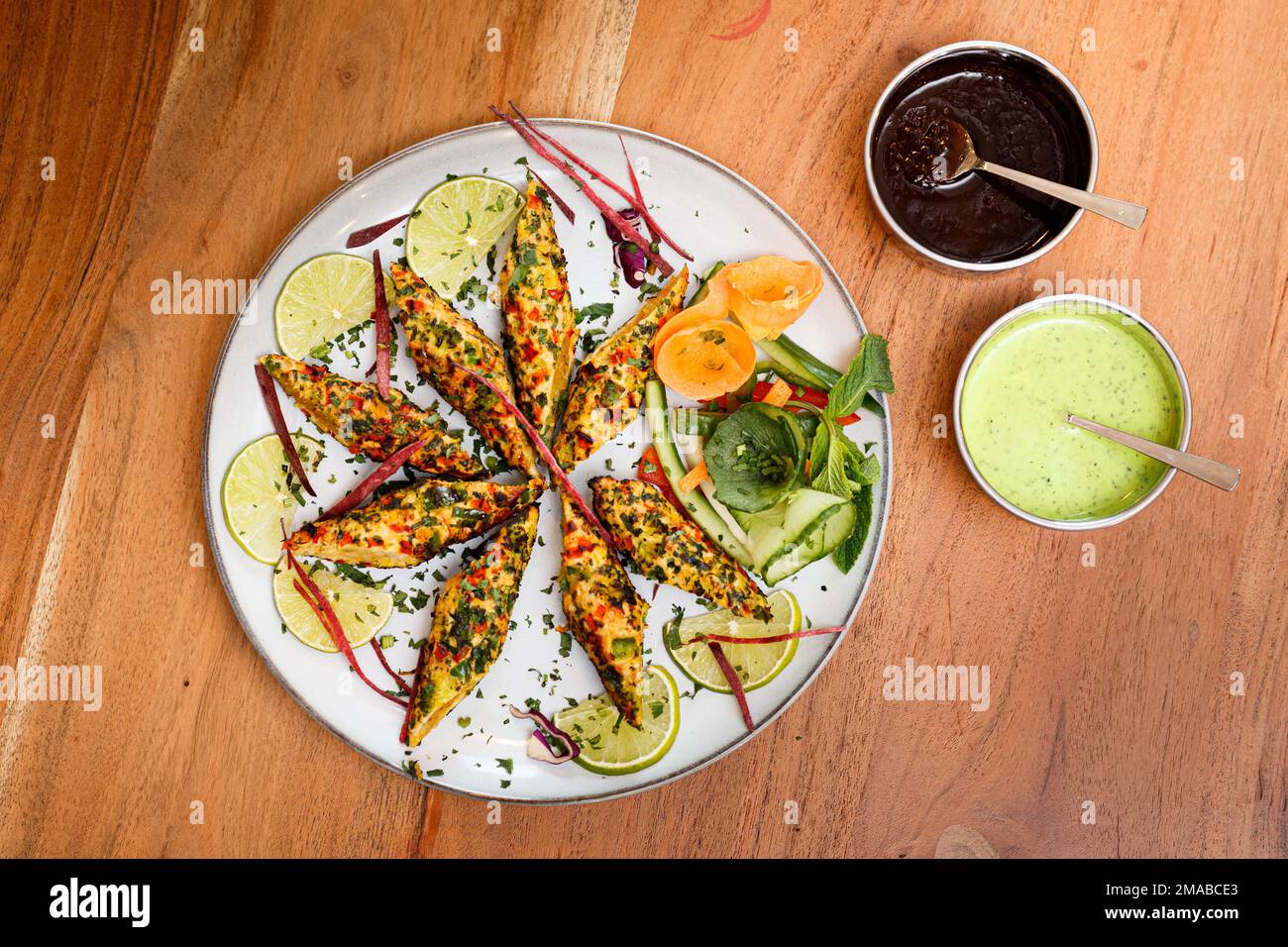 Chicken rolls prepared according to an Indian recipe Stock Photo - Alamy