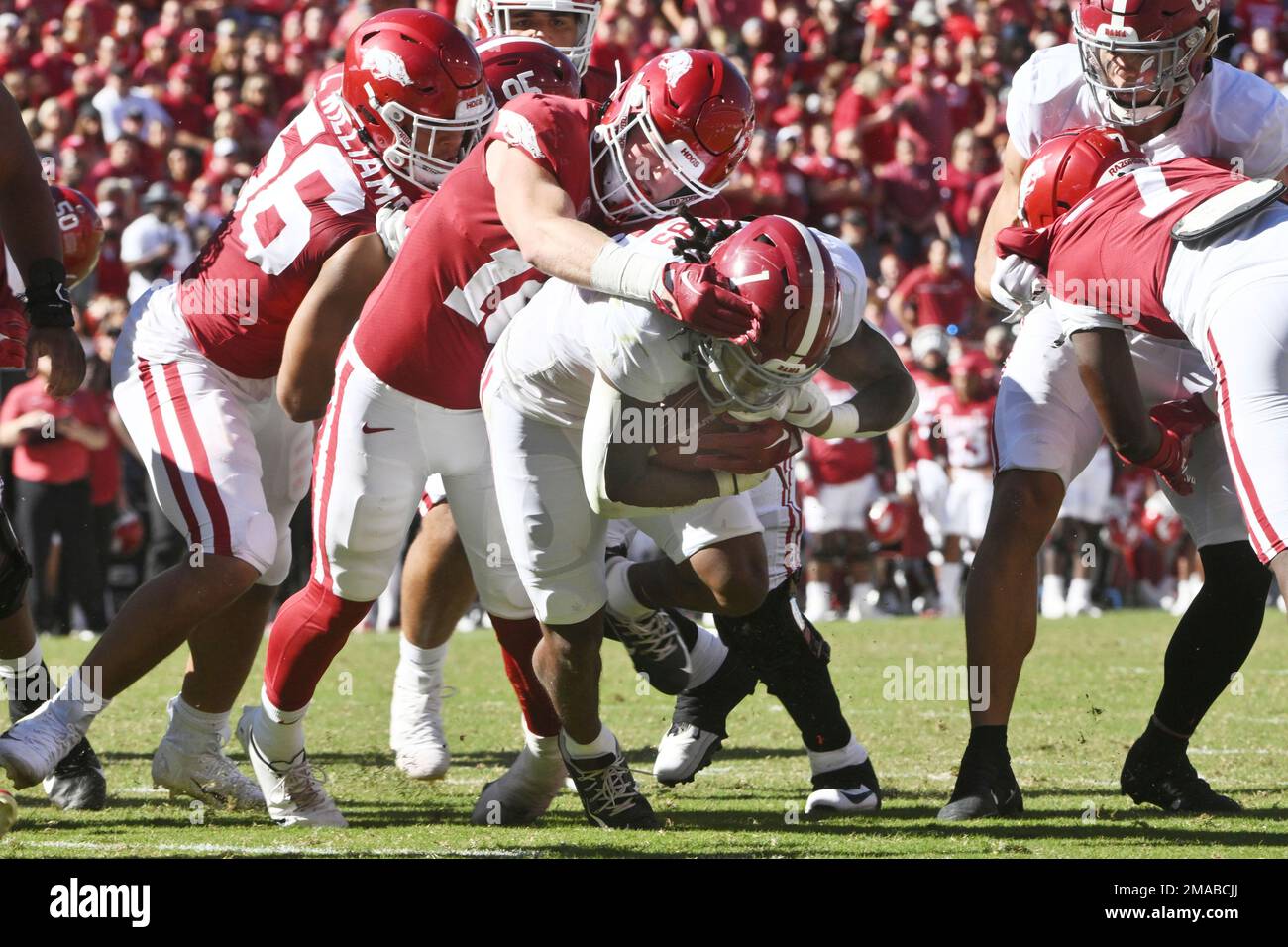 Arkansas linebacker Bumper Pool (10) tackles Alabama running back ...