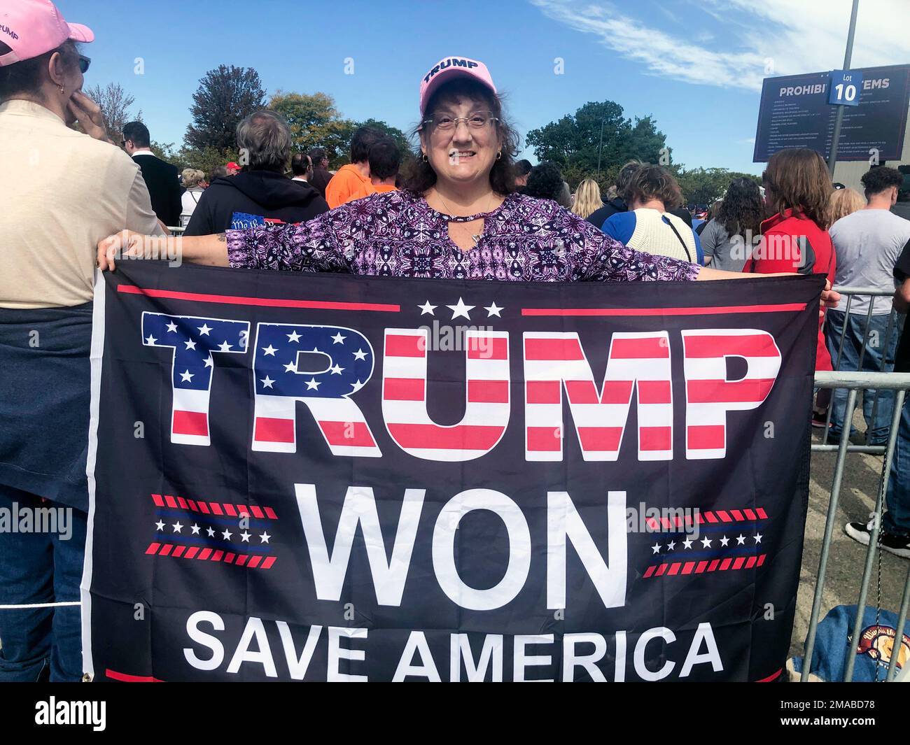 Paige Cole from Eastpointe Michigan holds up the flag she brough to ...