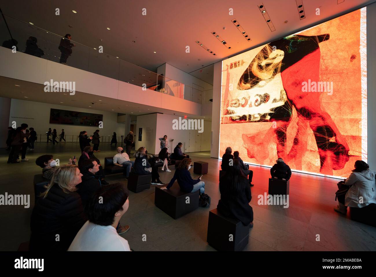 Visitors look at artist Refik Anadol's "Unsupervised" exhibit at the ...