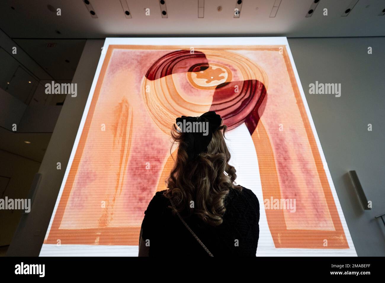 A visitor looks at artist Refik Anadol's "Unsupervised" exhibit at the ...