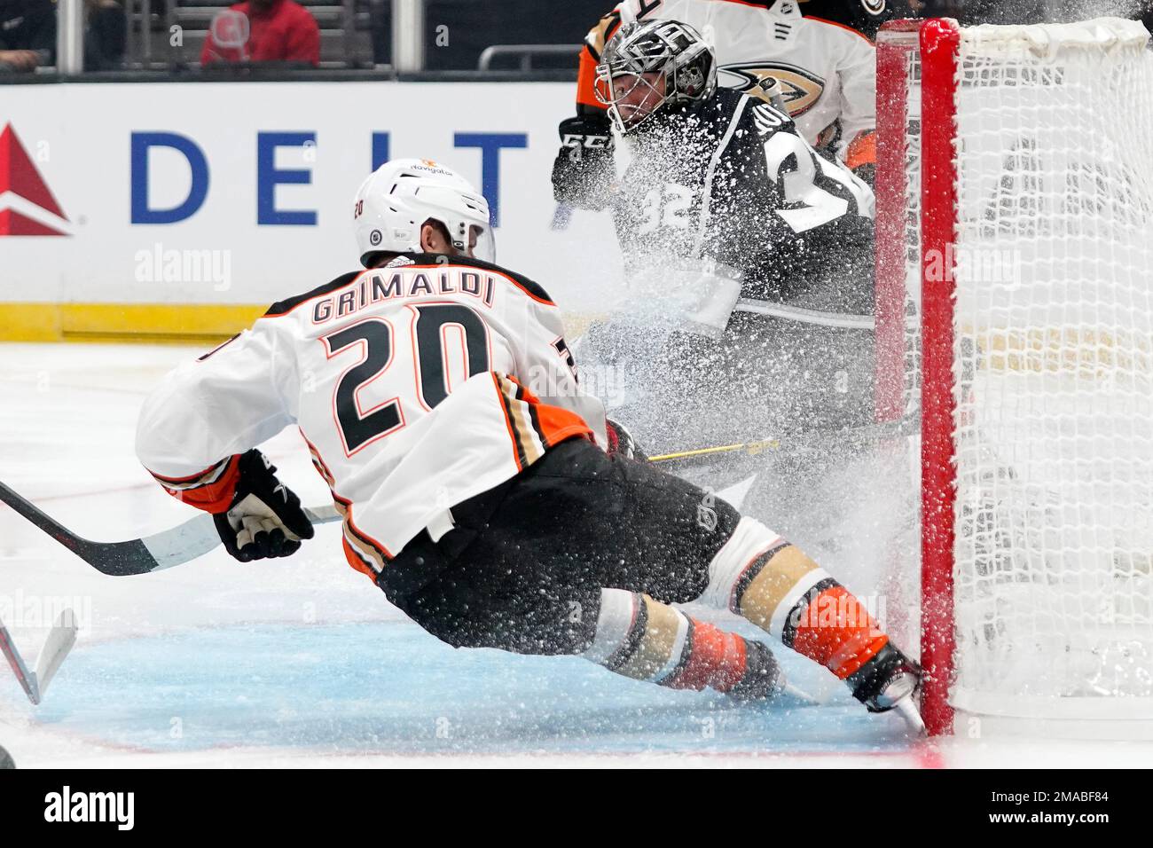 Anaheim Ducks' Rocco Grimaldi, left, scores on Los Angeles Kings ...