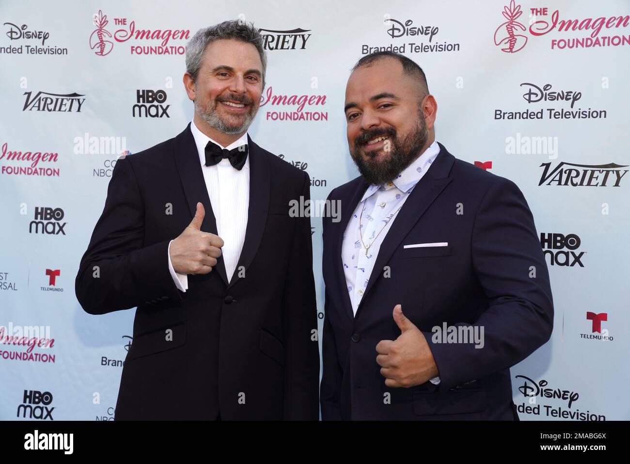 Jason Shuman, left, and Eduardo Cisneros arrive at the Imagen Awards on ...