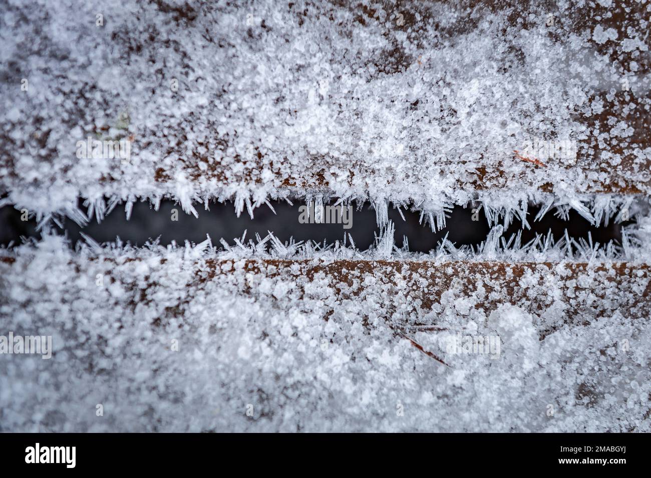 Wooden path covered crystals of ice. Frost on boards. Background ...