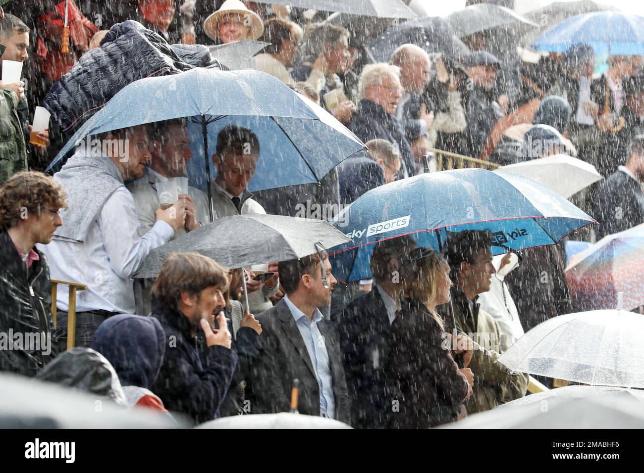 Spectators in stand rain hi-res stock photography and images - Alamy