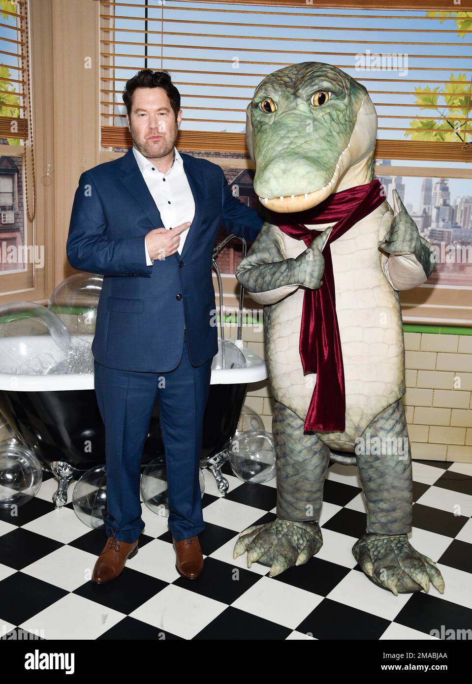 Producer-director Josh Gordon, left, poses with the Lyle Crocodile ...