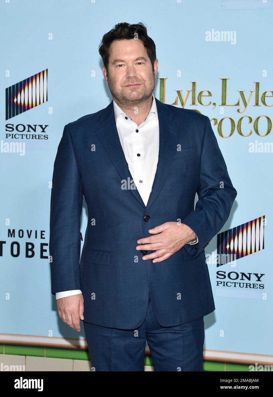 Producer-director Josh Gordon, left, poses with the Lyle Crocodile ...