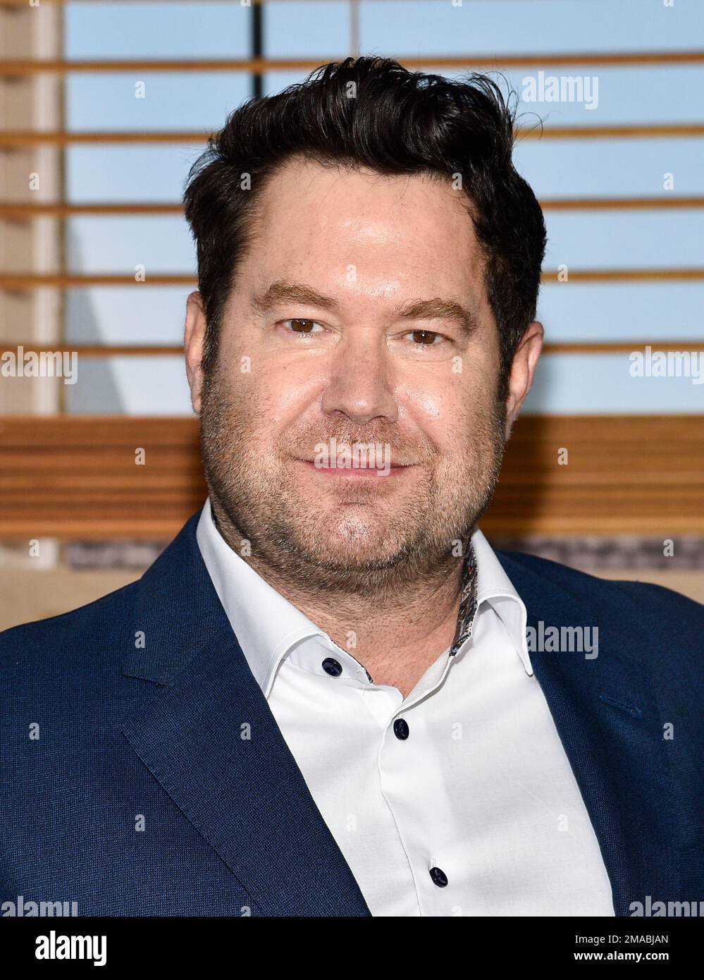 Producer-director Josh Gordon, left, poses with the Lyle Crocodile ...