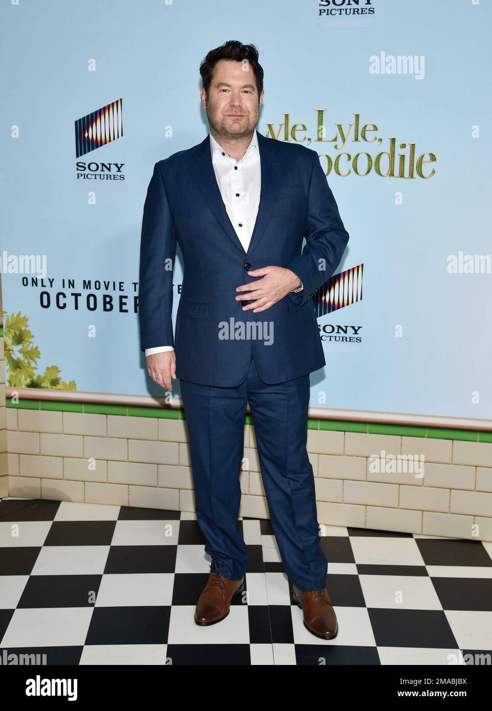 Producer-director Josh Gordon, left, poses with the Lyle Crocodile ...