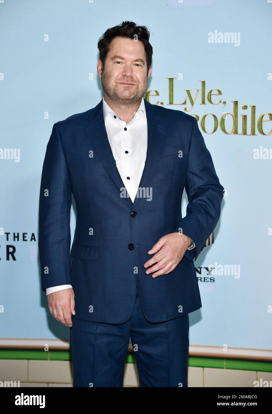 Producer-director Josh Gordon, left, poses with the Lyle Crocodile ...