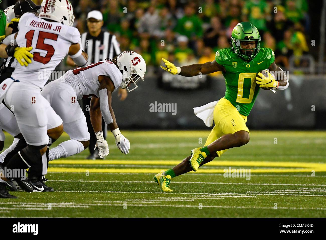 Oregon running back Bucky Irving (0) eludes the tackle of Stanford ...
